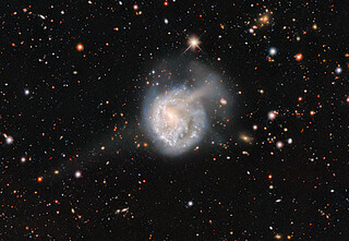 The Tidal Tales of NGC 922 | NOIRLab